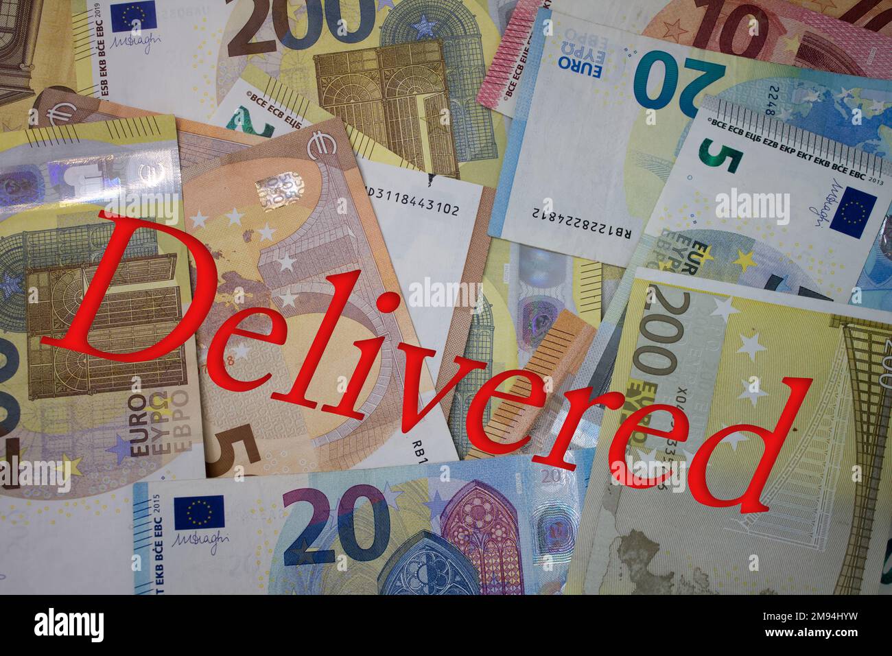 Delivered word with money. Paper currency background with different ...