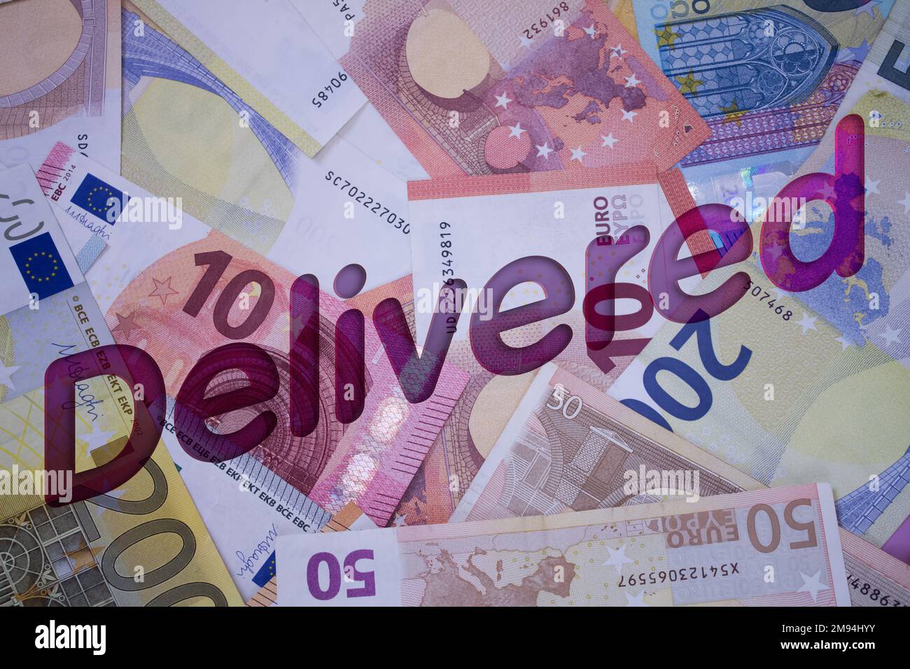 Delivered word with money. Paper currency background with different ...