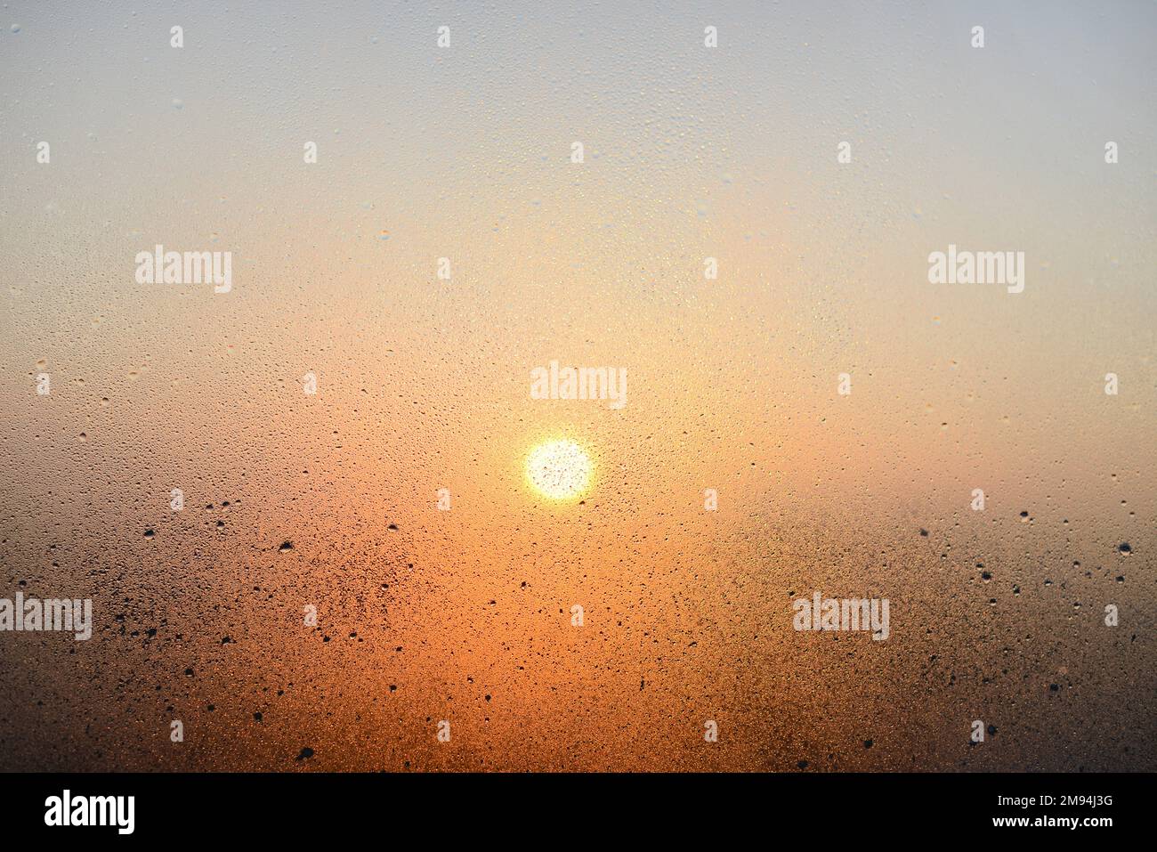 Fogged glass window with raindrops, blurred background. City view and ...