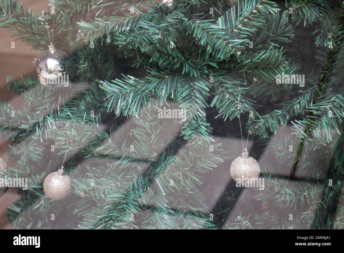 Christmas tree decor on the window of a wooden house, stock photo Stock ...