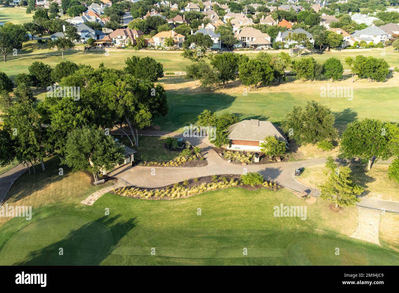 Aerial view from the height of the village with houses, streets meadows ...