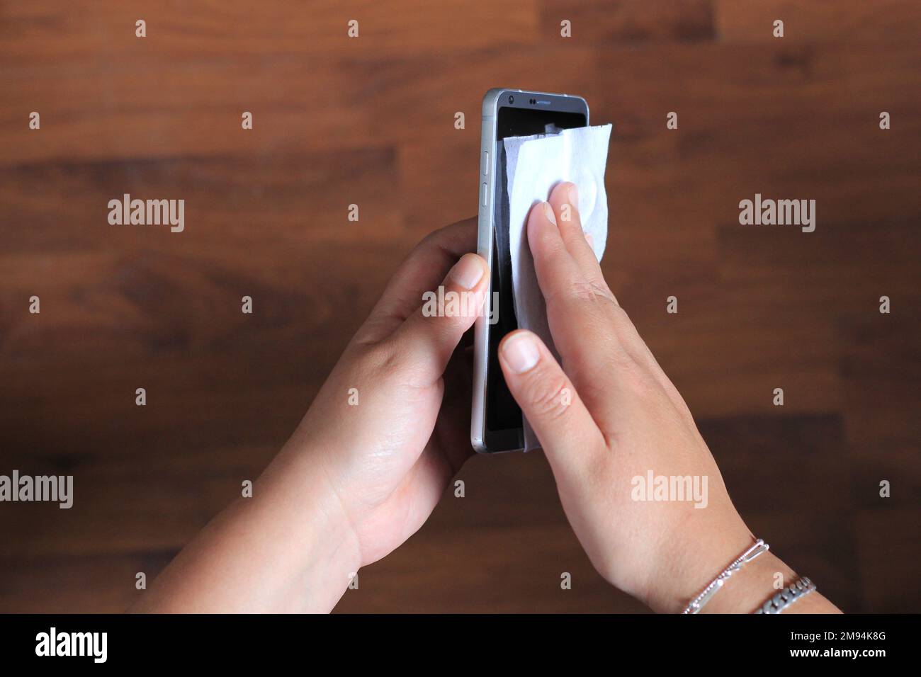 Hygiene at home, clean and disinfect cell phone with an antibacterial ...