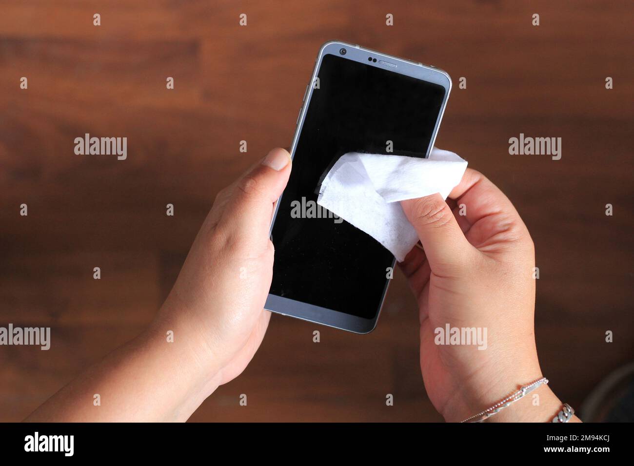 Hygiene at home, clean and disinfect cell phone with an antibacterial ...