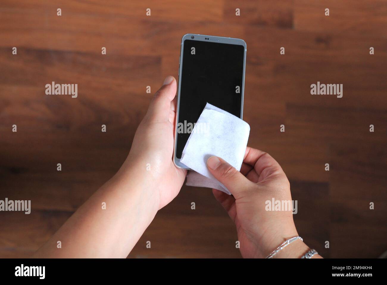 Hygiene at home, clean and disinfect cell phone with an antibacterial ...