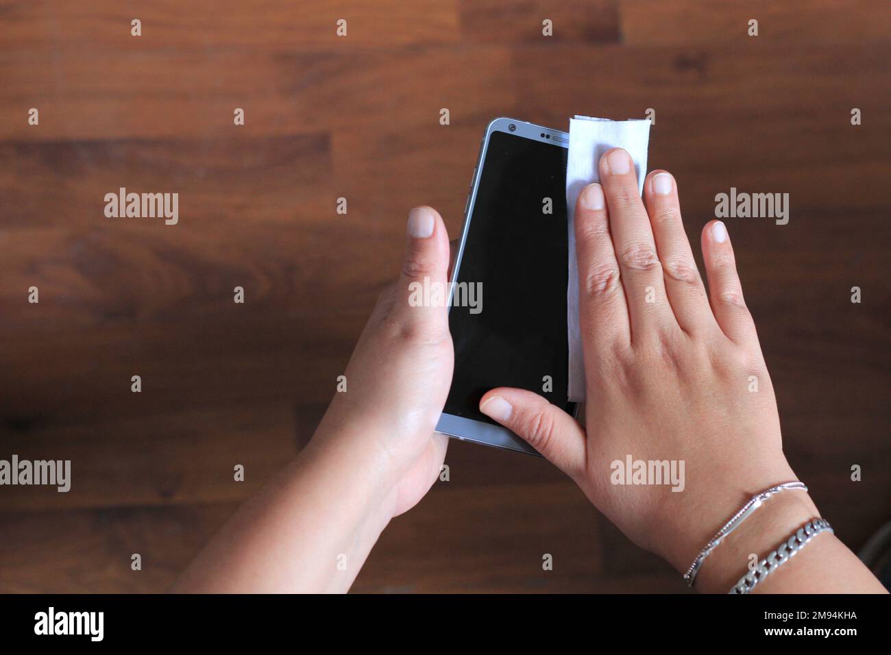 Hygiene at home, clean and disinfect cell phone with an antibacterial ...