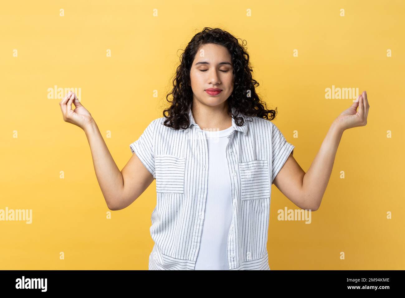 Portrait of adorable peaceful calm relaxed woman with dark wavy hair ...