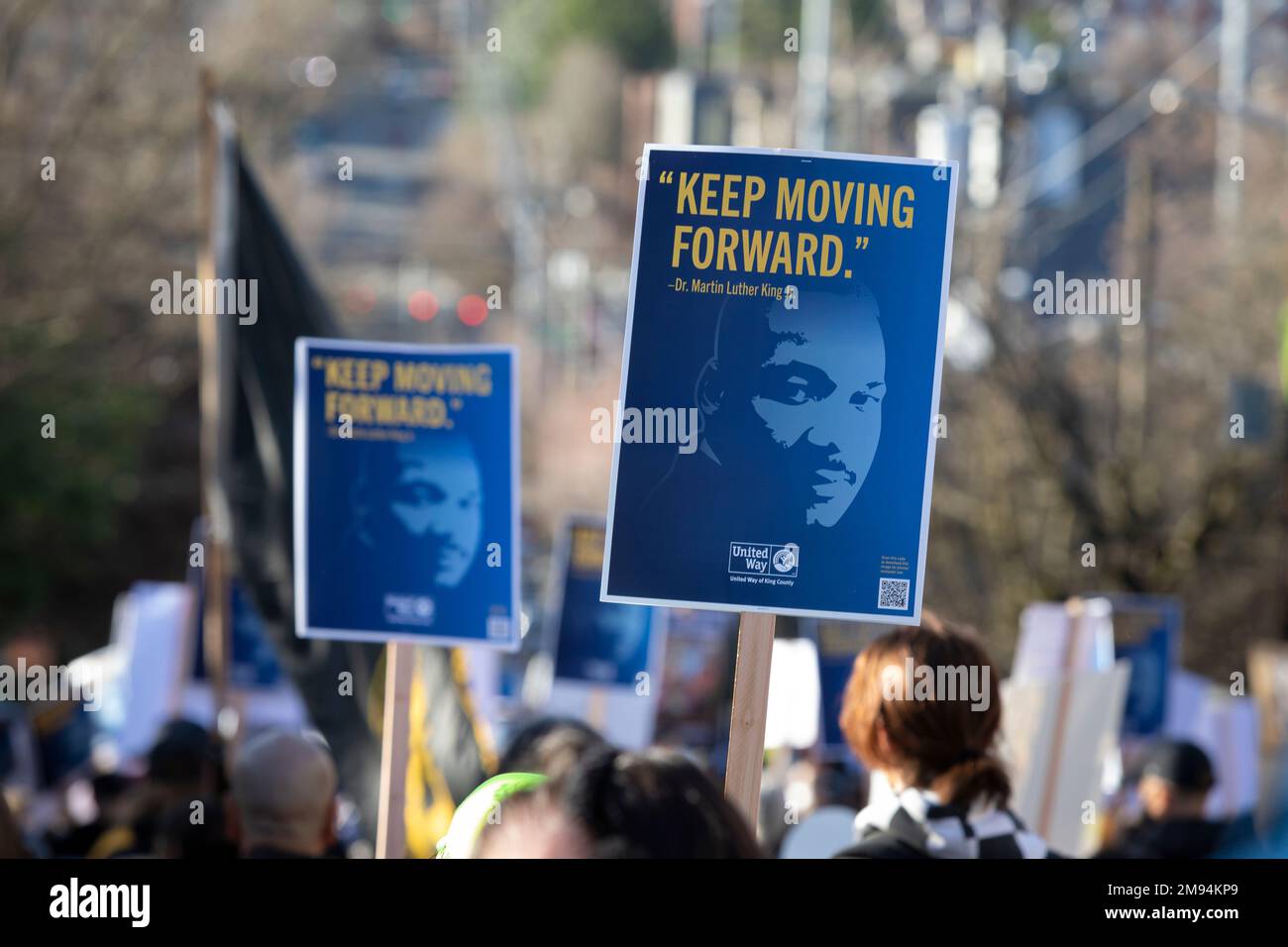 Seattle, Washington, USA. 16th January, 2023. Participants hold signs ...
