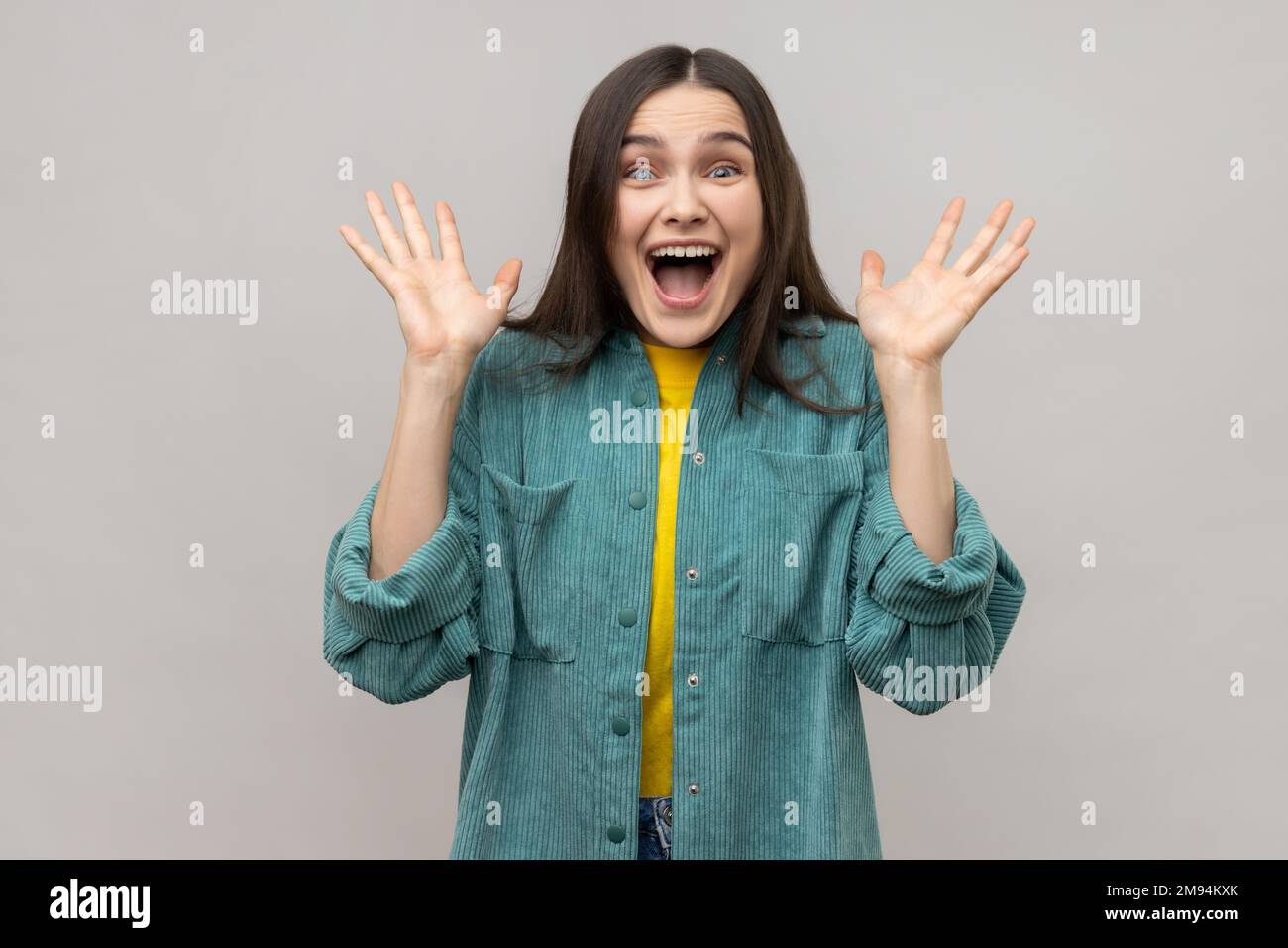 Portrait of positive attractive woman looking at camera with excitement ...