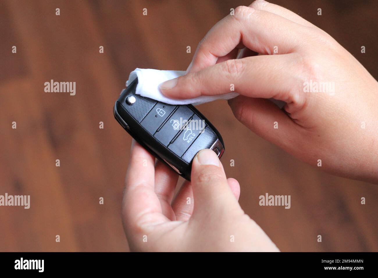 Hygiene at home, Clean the car key with a damp antibacterial towel ...