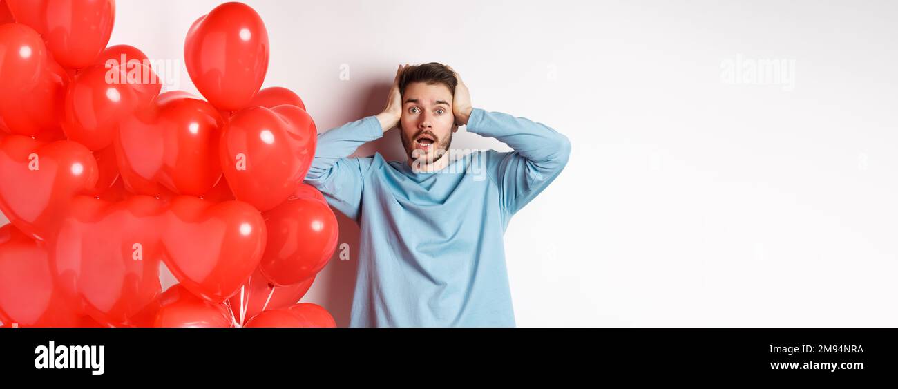 Confused boyfriend holding hands on head and panicking on Valentines ...