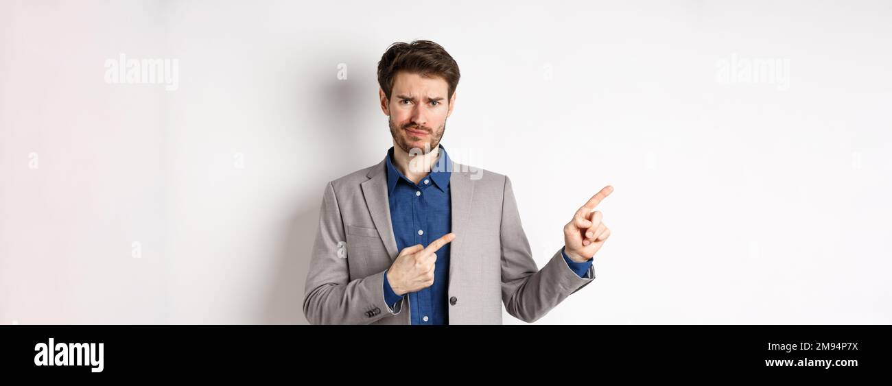 Bad idea. Displeased skeptical guy in business suit smirk and frown ...