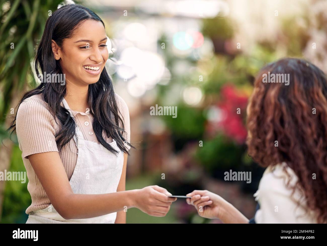 Come back any time. a customer using a card to make a payment Stock ...