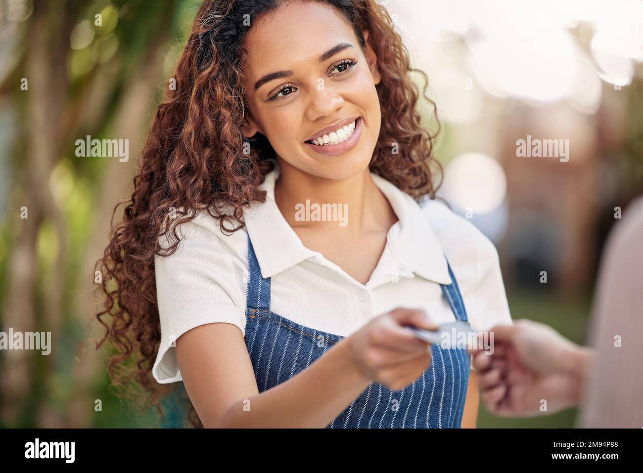 Happy to help you. a customer using a card to make a payment Stock ...