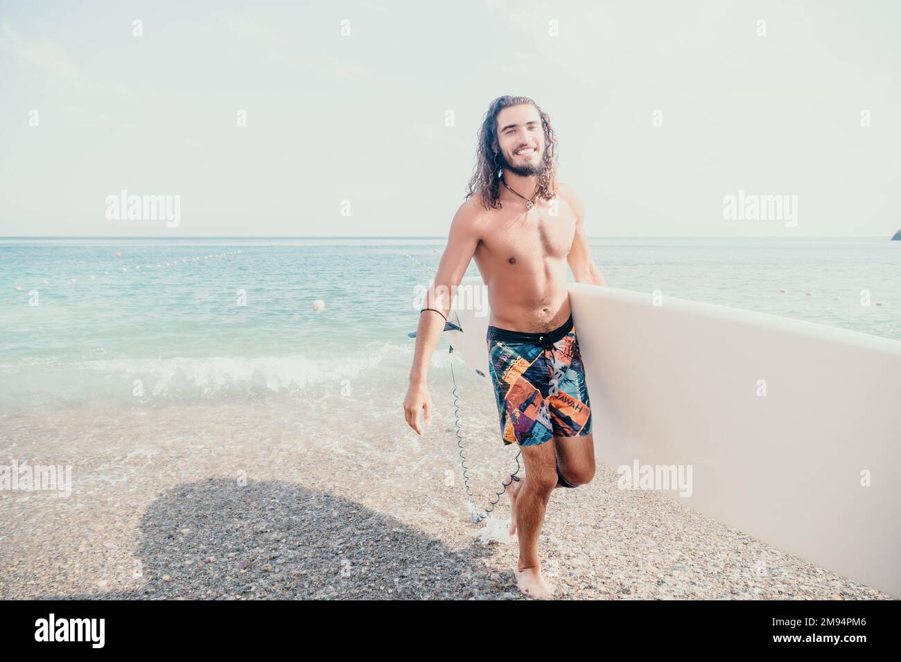 Sea man sup. Asian athlete man swimming in sea and paddleboarding at ...