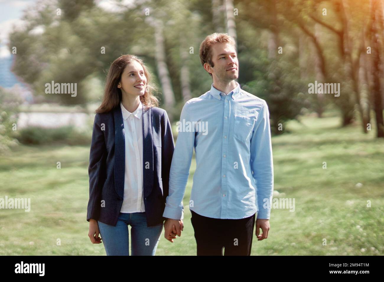 happy couple in love walking holding hands Stock Photo - Alamy
