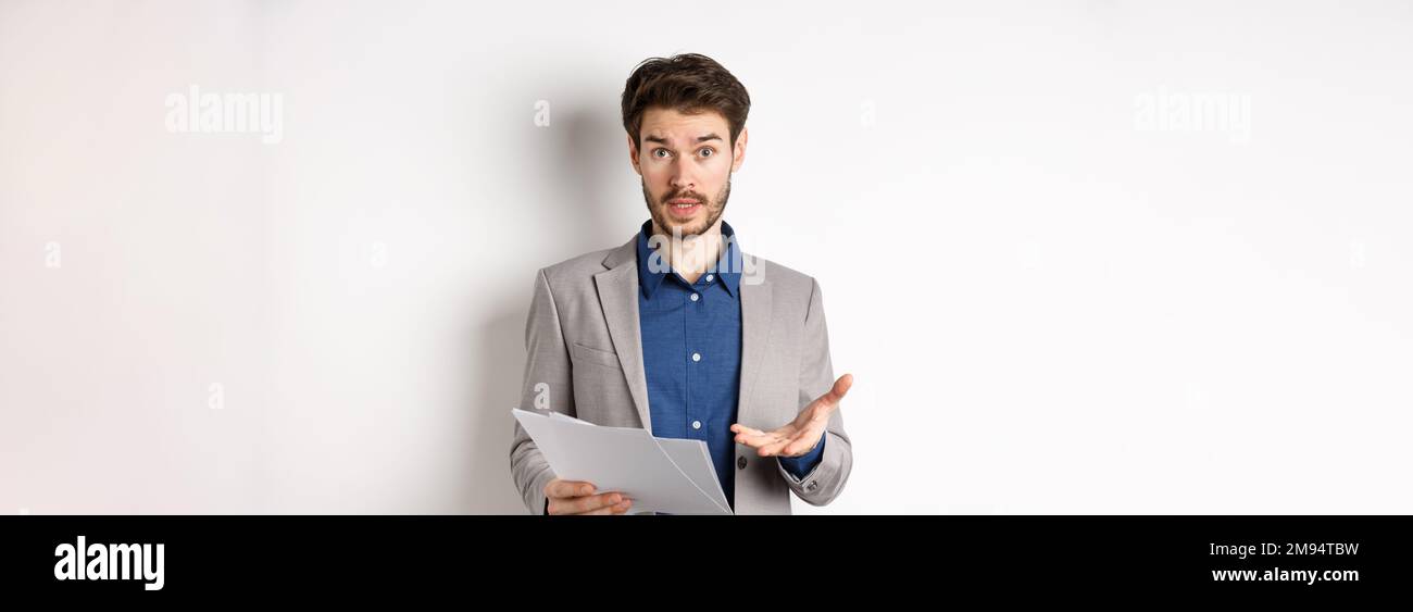 Confused businessman looking at bad document, complaining on deal ...
