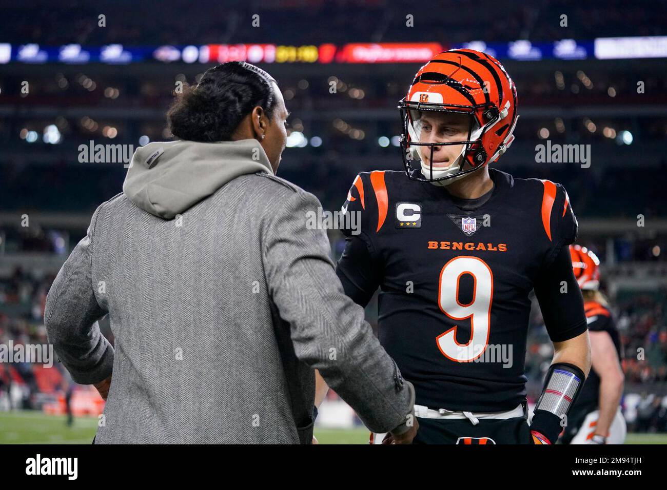 Cincinnati Bengals quarterback Joe Burrow (9) embraces former player T ...