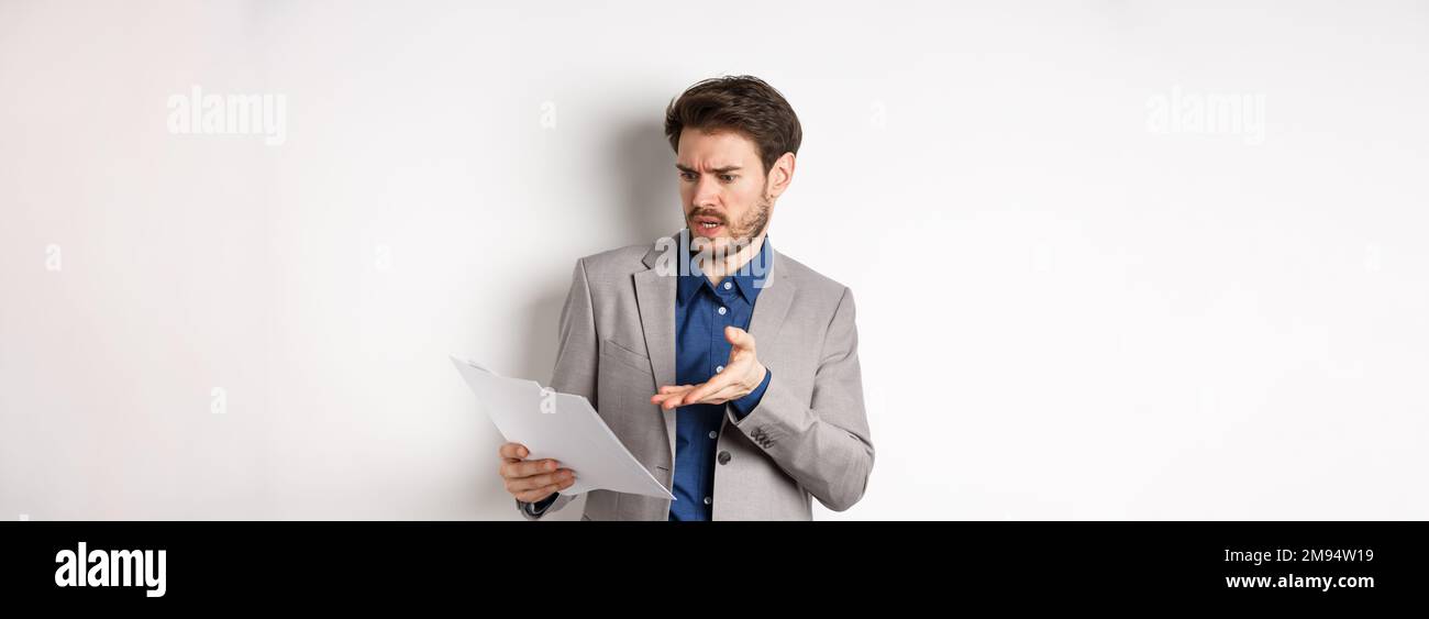 Angry employer looking at bad document, complaining on deal, pointing ...