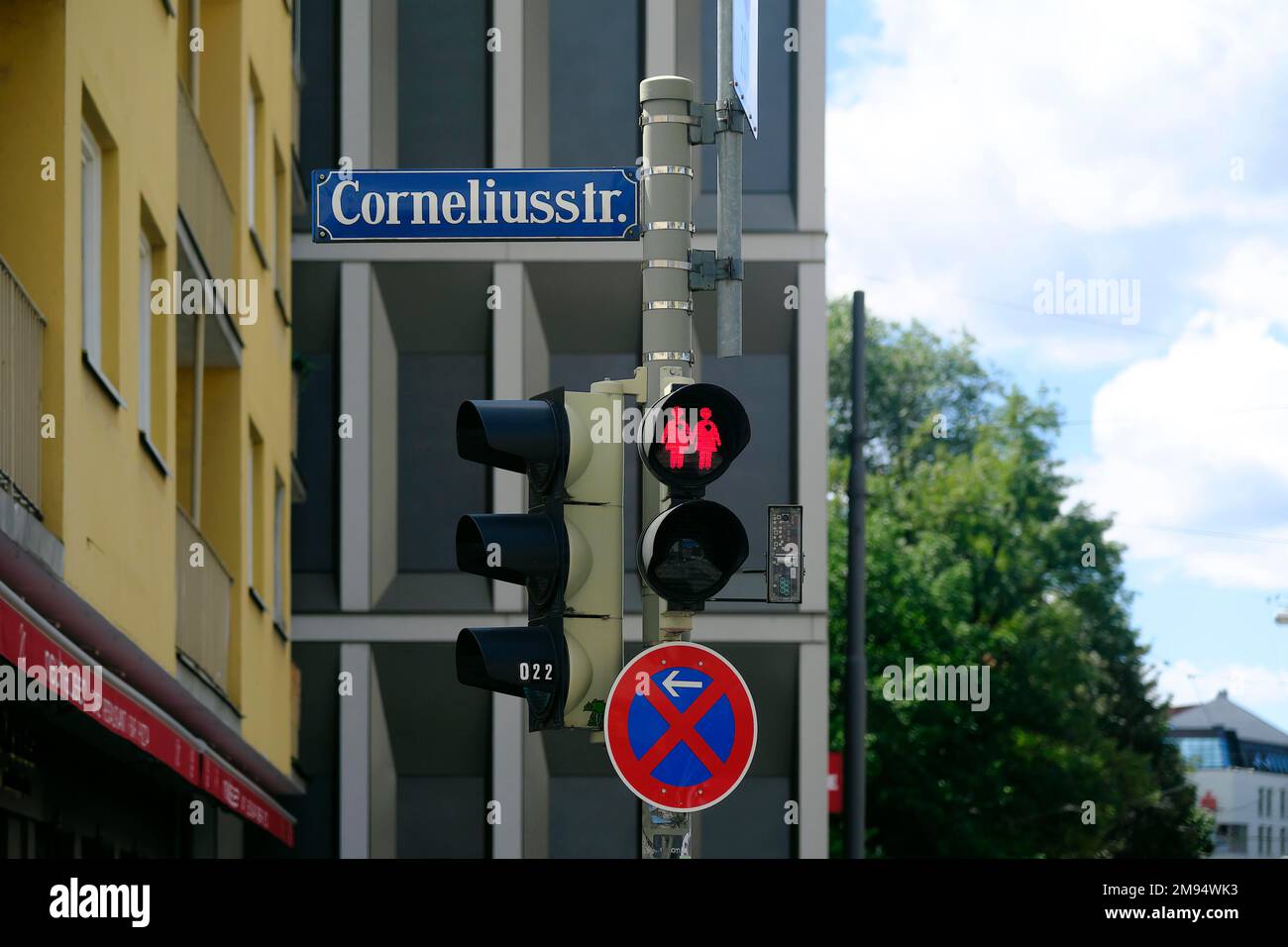 Gender-inclusive traffic light sign, pedestrian traffic light in ...