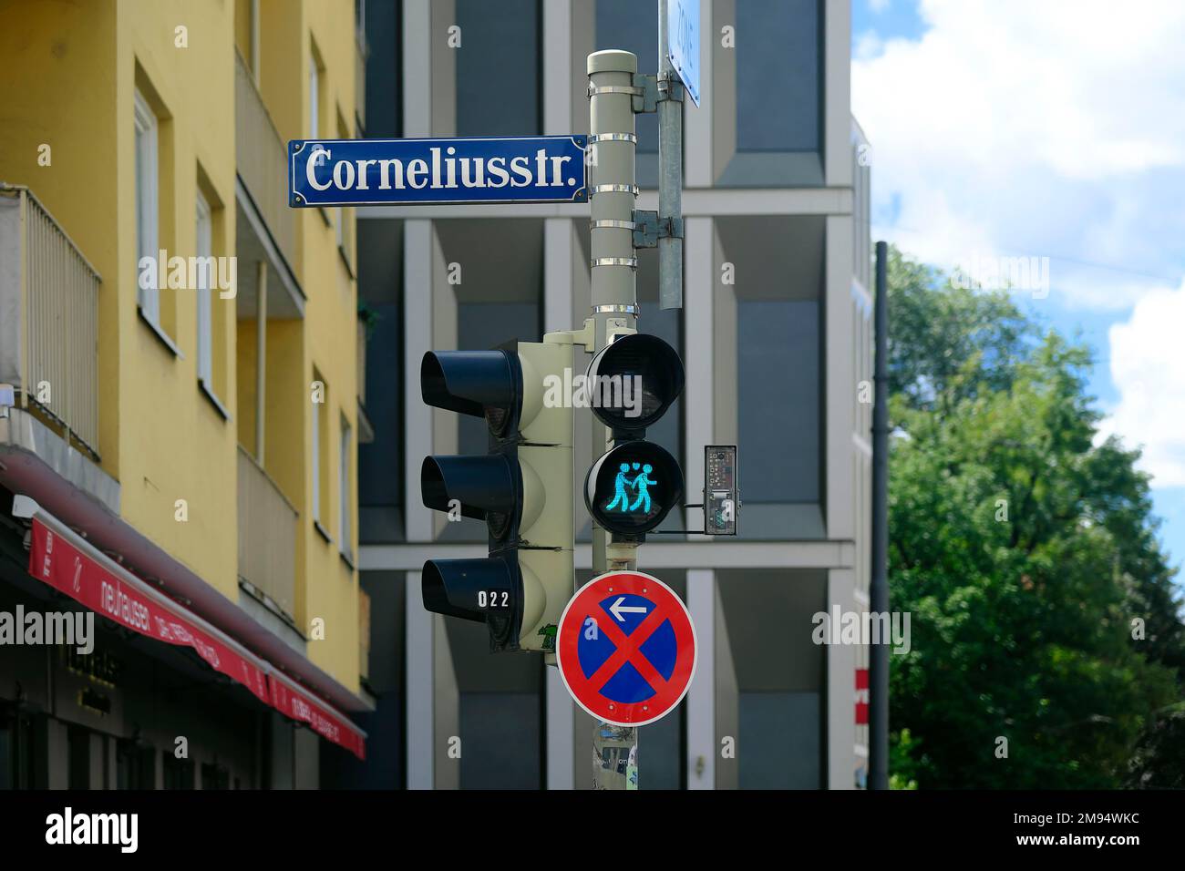 Gender-inclusive traffic light sign, pedestrian traffic light in ...