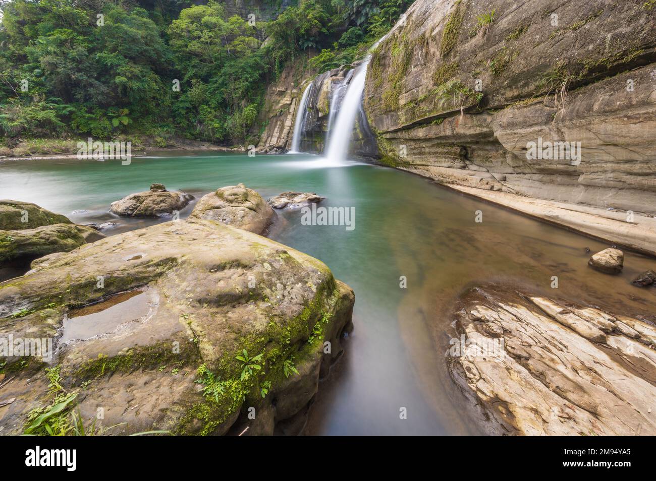 Small but beautiful waterfalls, clear streams, big rocks and green ...
