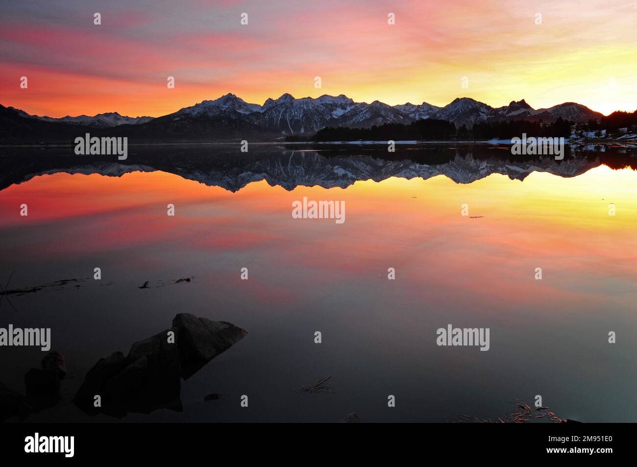 Sunset at the Forggensee with view of the Saeuling near Fuessen ...