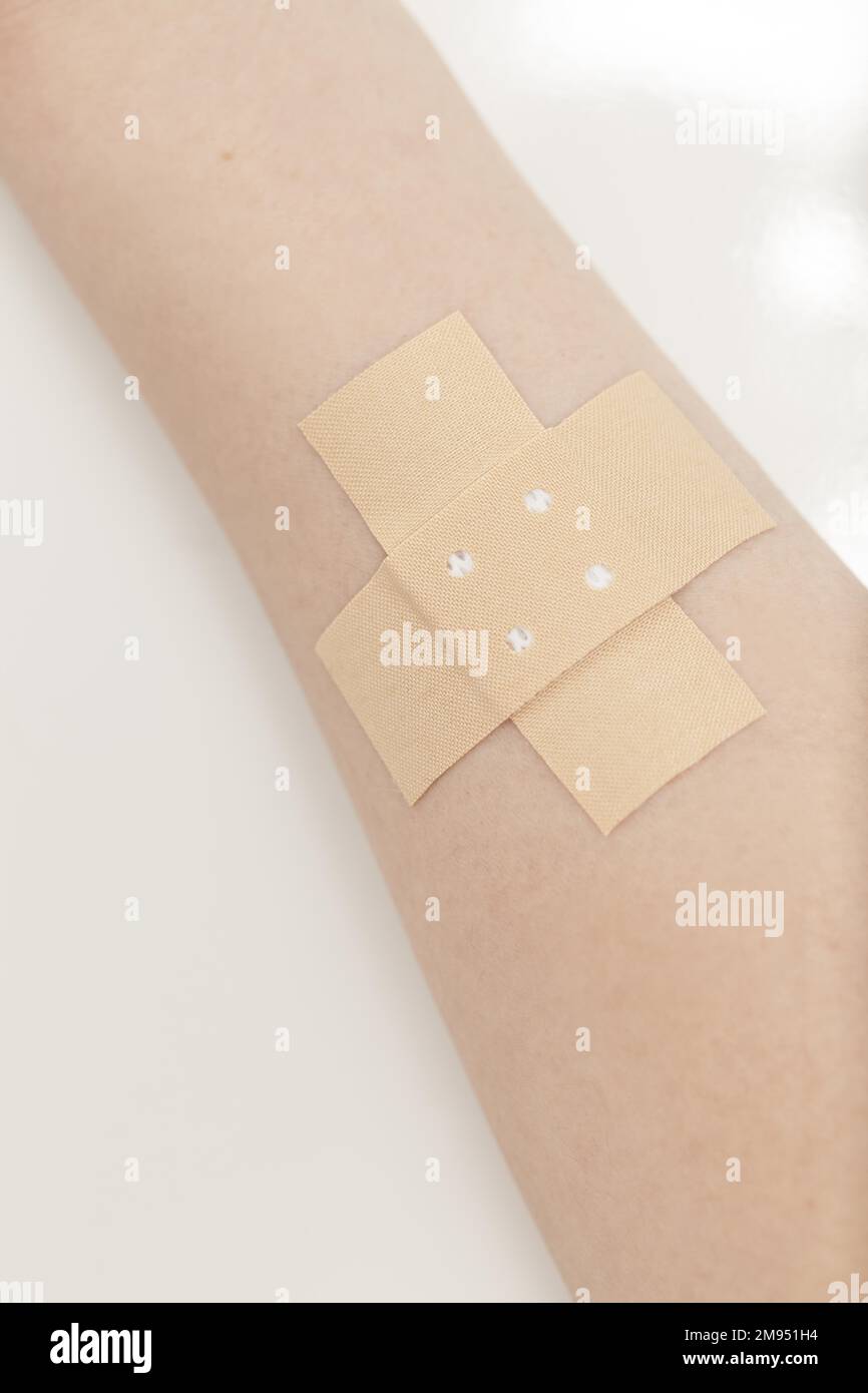 Plaster on arm Stock Photo - Alamy