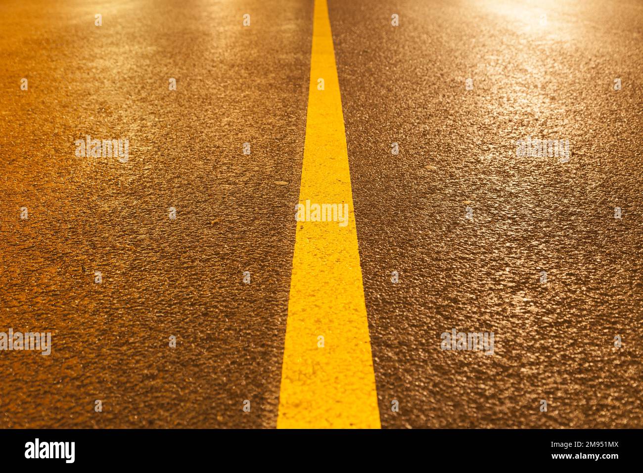 Yellow road marking in rain and at night, USA Stock Photo - Alamy