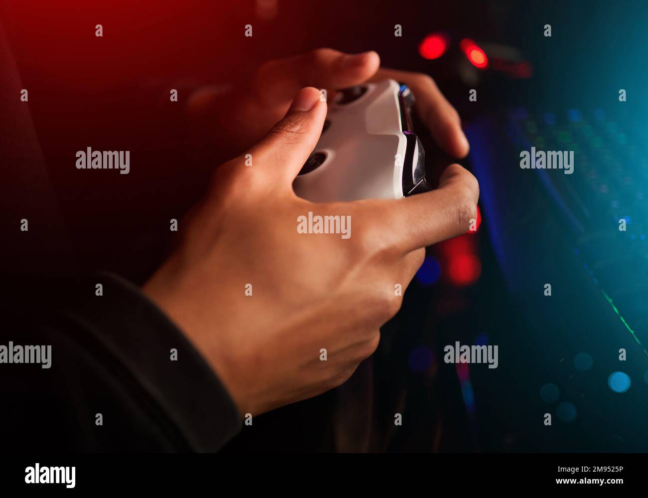 The hands of a gamer. an unrecognizable male gamer playing video games ...