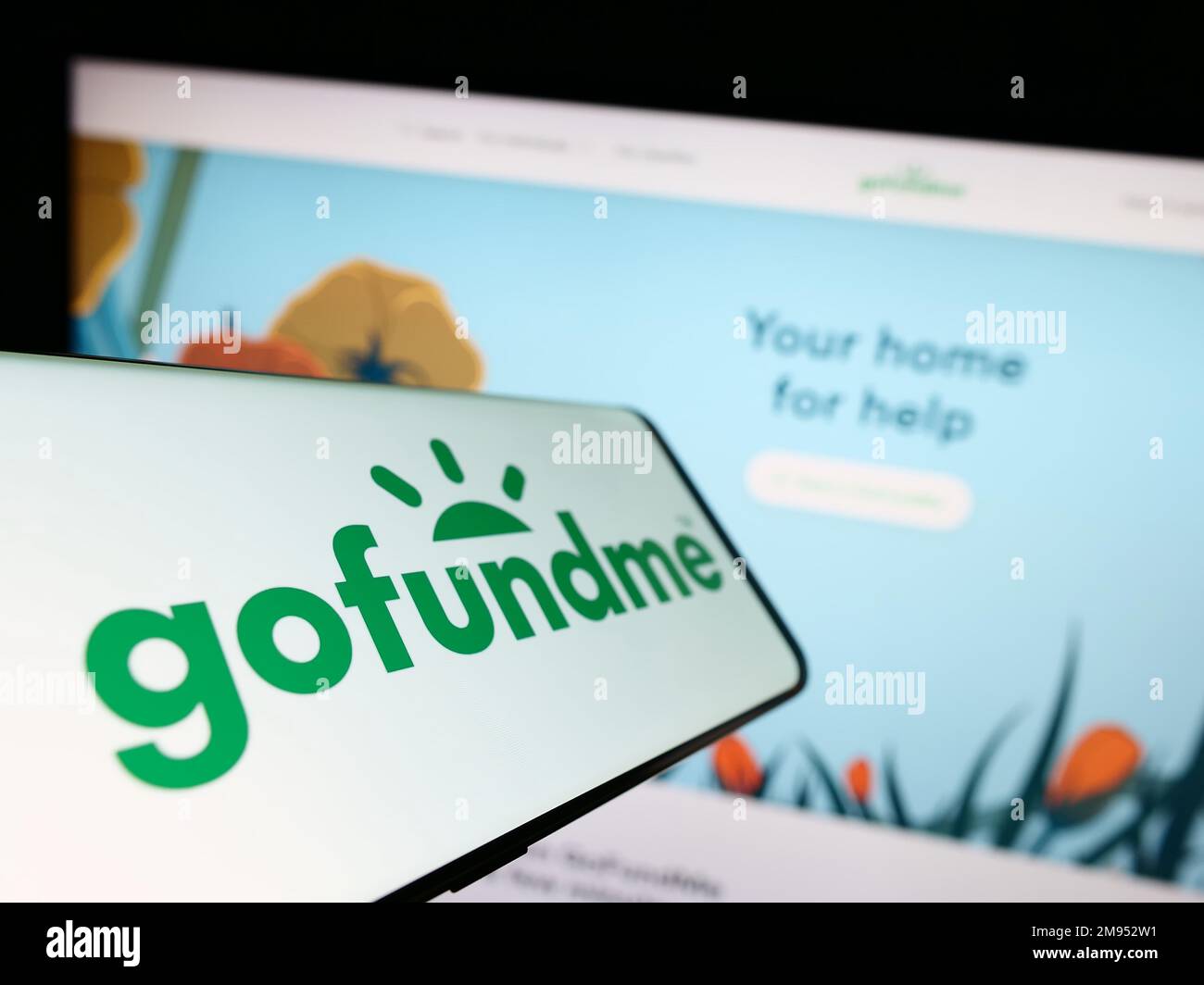 Mobile phone with logo of crowdfunding platform company GoFundMe on ...