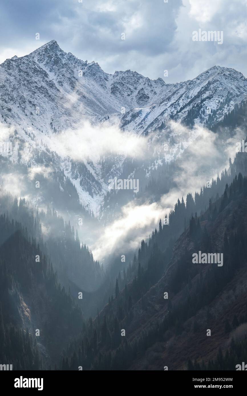 Snow Mountain with cloudy sky from Almaty region in Kazakhstan. Central ...