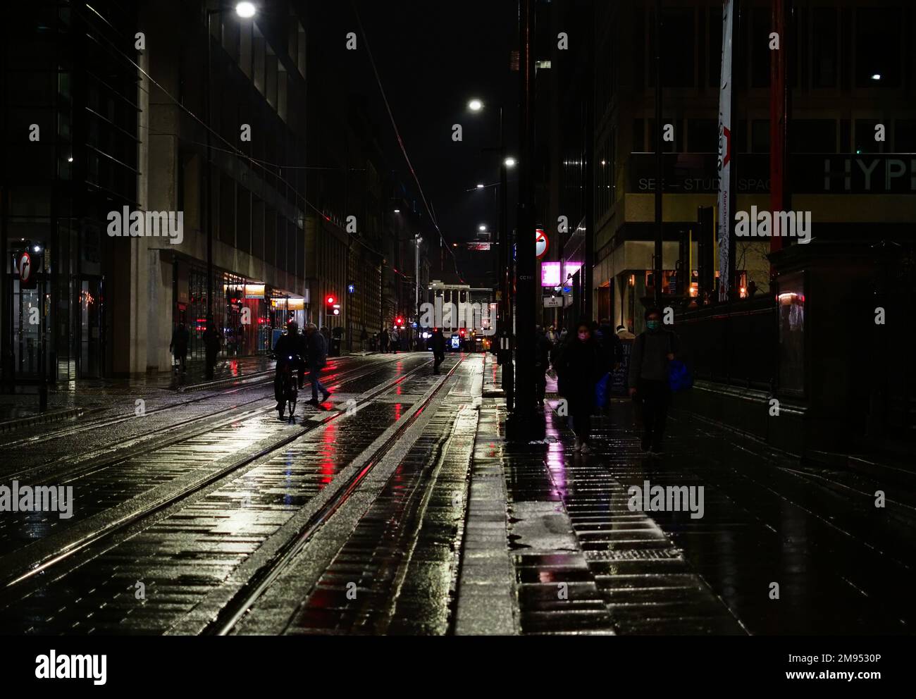 A rainy street surrounded by buildings in Manchester Stock Photo - Alamy