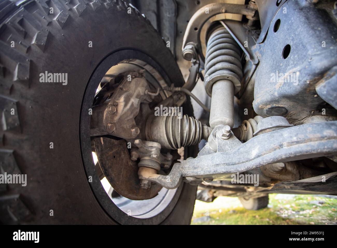 Car steering and suspension system of a suv. Close-up of front wheel ...