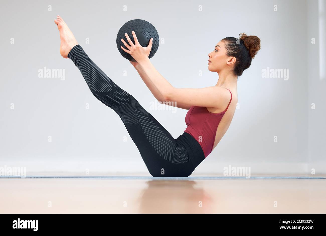 Building a stronger core one rep at a time. a young woman doing core ...