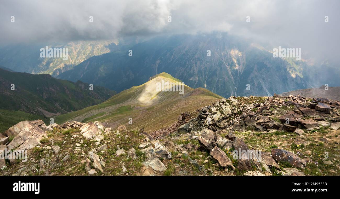 Rocky slopes in the central asian mountains. Amazing view from peak on ...
