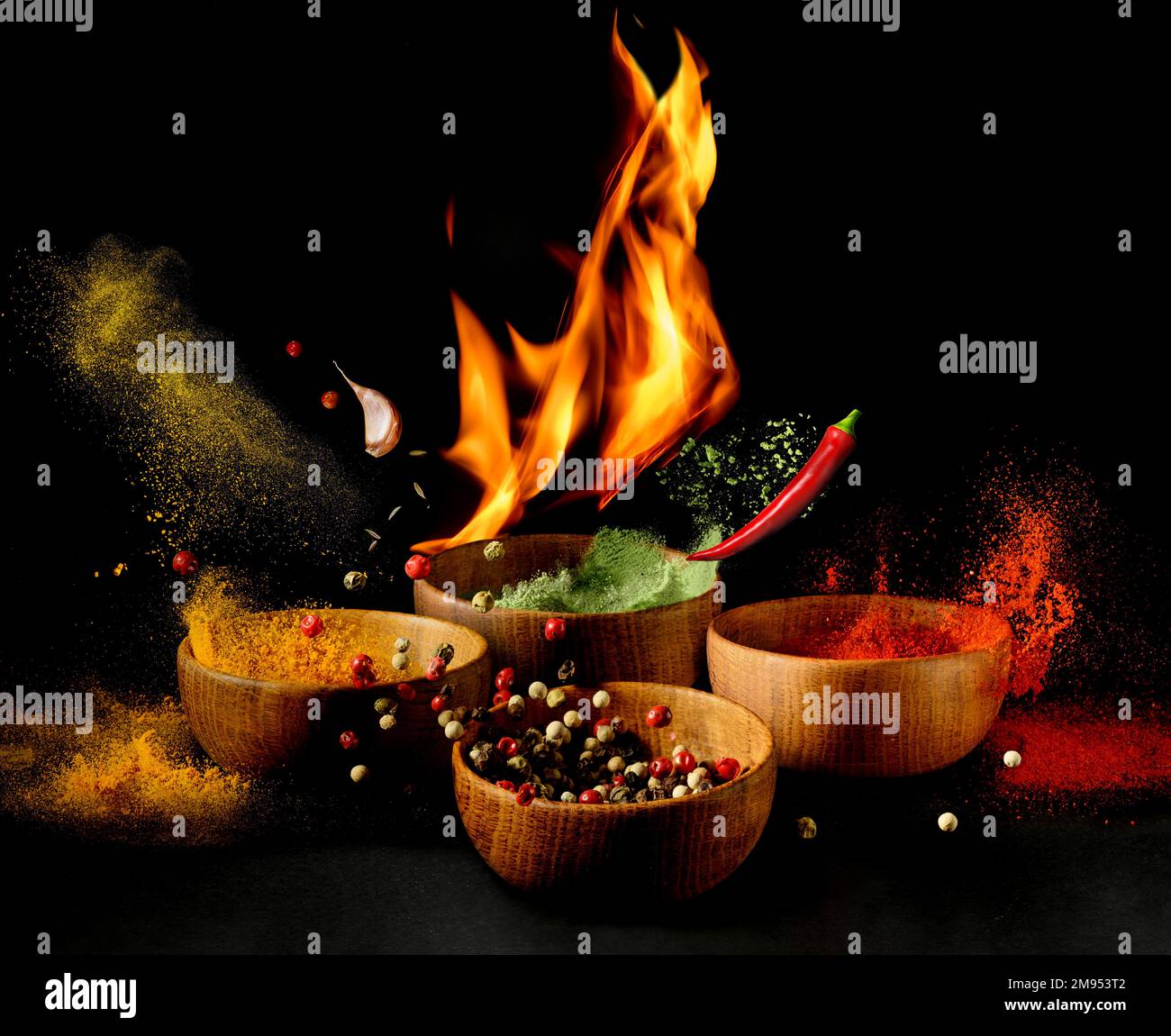 Hot Spices and seasonings powder splash, explosion on black background ...