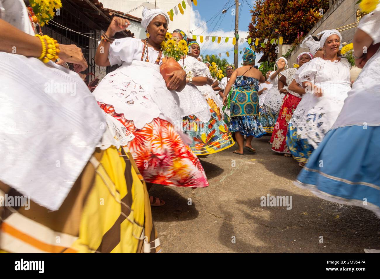 A view of Candomble members in traditional clothes during religious ...