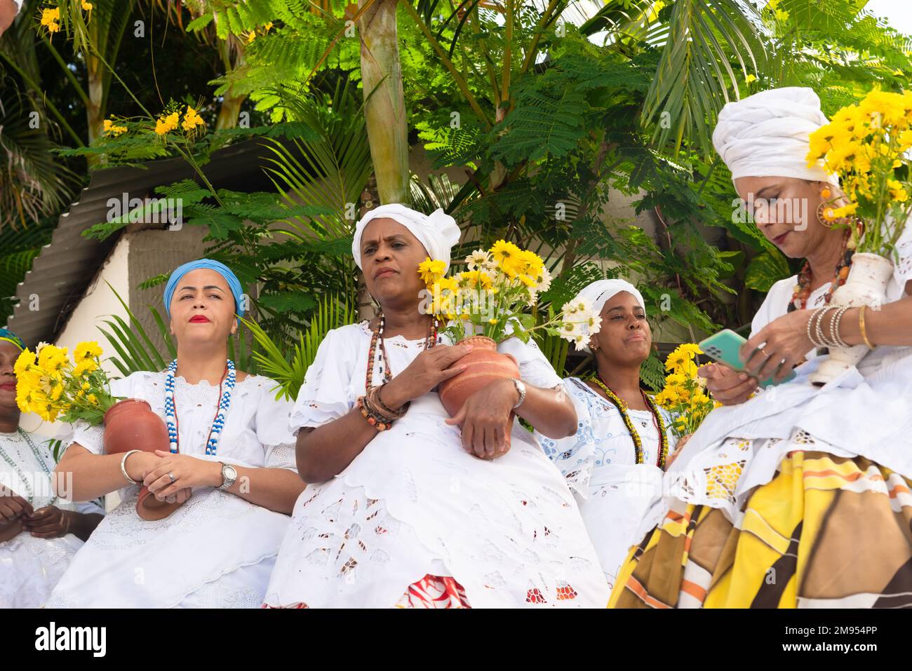 A view of Candomble members in traditional clothes during religious ...