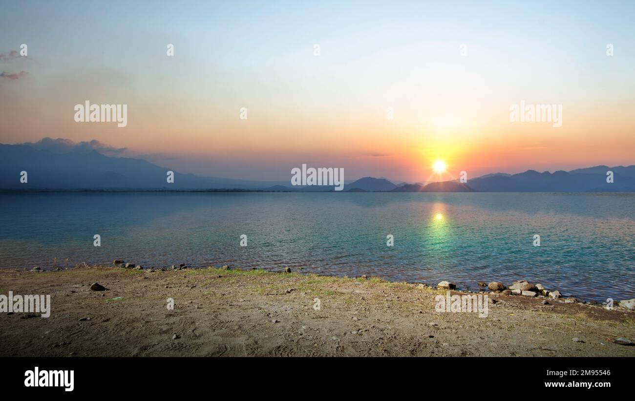 The landscape of a lake with a sunset sky background Stock Photo - Alamy