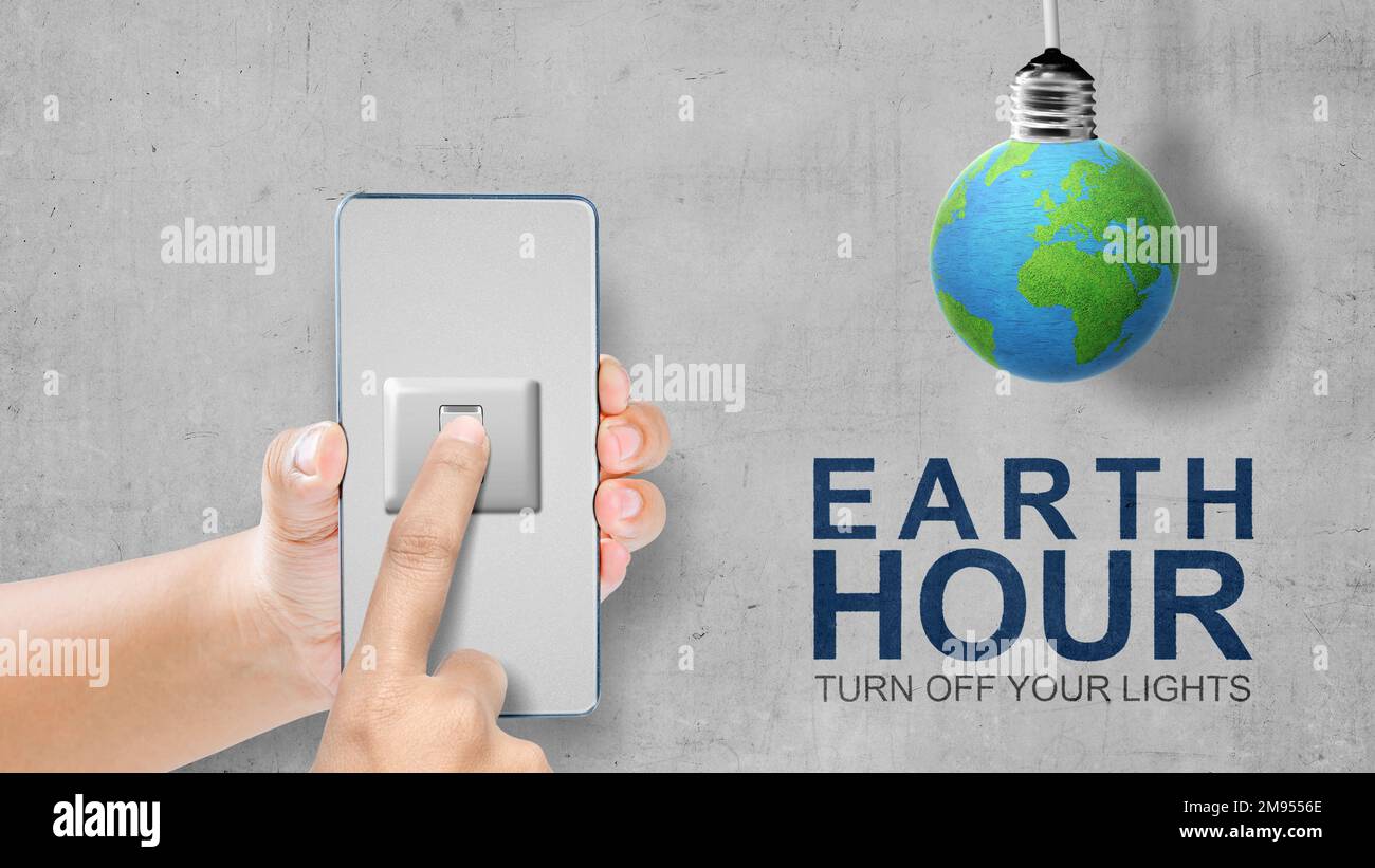 Human hand turning off the switch. Earth Hour Concept Stock Photo - Alamy