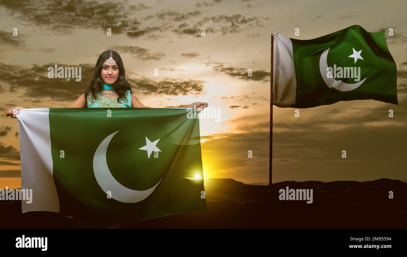 Asian woman holding Pakistan flag. Pakistan Resolution Day Stock Photo ...