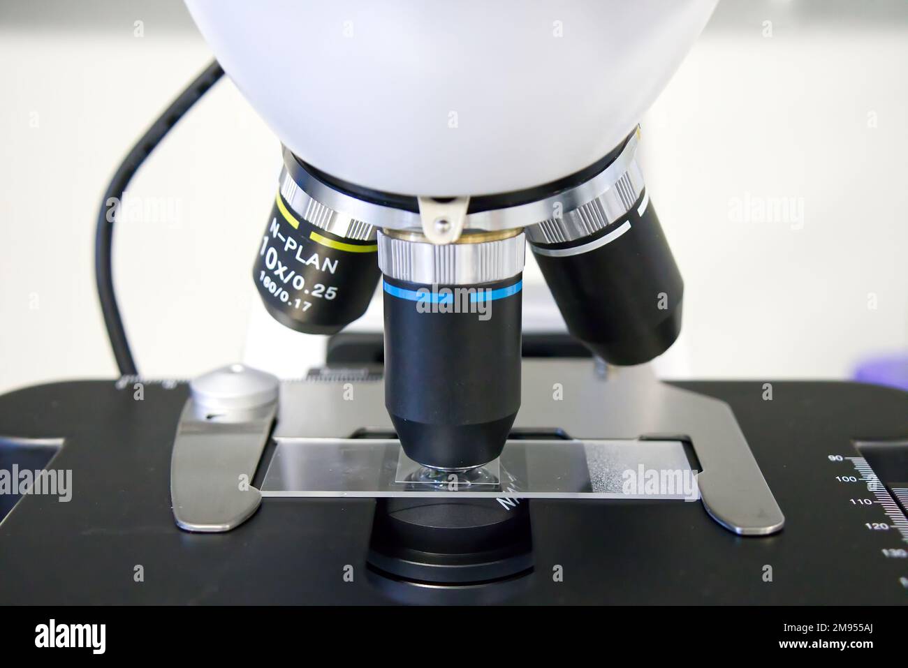 Laboratory microscope with different lenses closeup. Scientific and ...