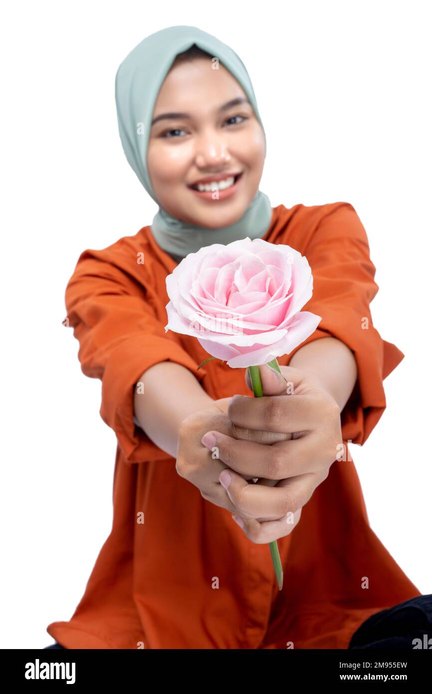 Young muslim woman rose flower hi-res stock photography and images - Alamy