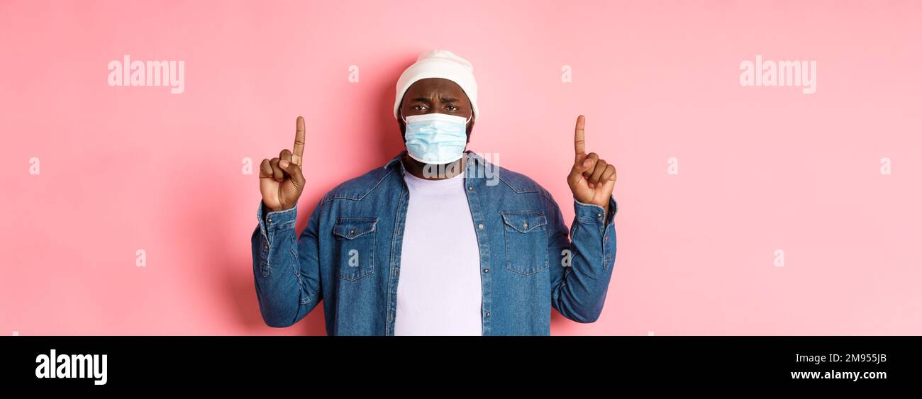 Coronavirus, lifestyle and global pandemic concept. Upset Black man in ...