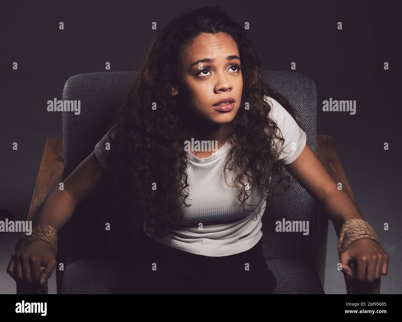 Tied to chair hi-res stock photography and images - Alamy