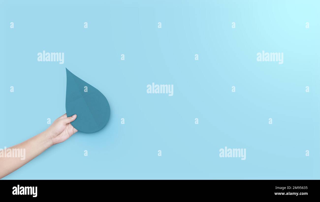 Human hand holding water drop. World Water Day Stock Photo - Alamy