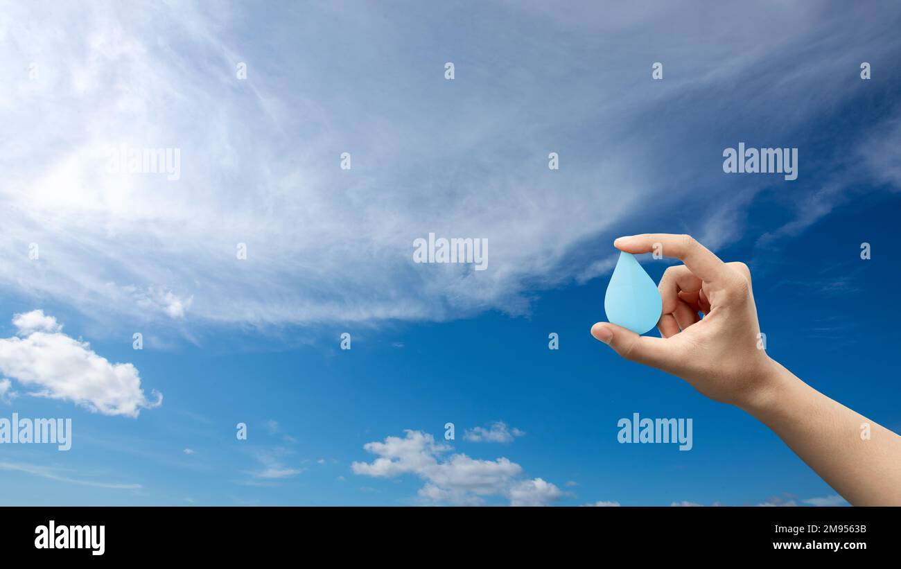 Human hand holding water drop. World Water Day Stock Photo - Alamy