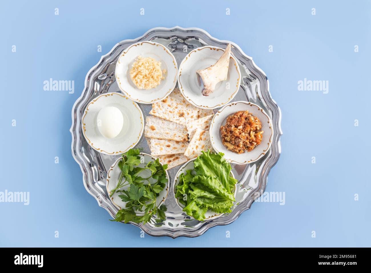 a silver plate with traditional Jewish treats for Passover. baked egg ...