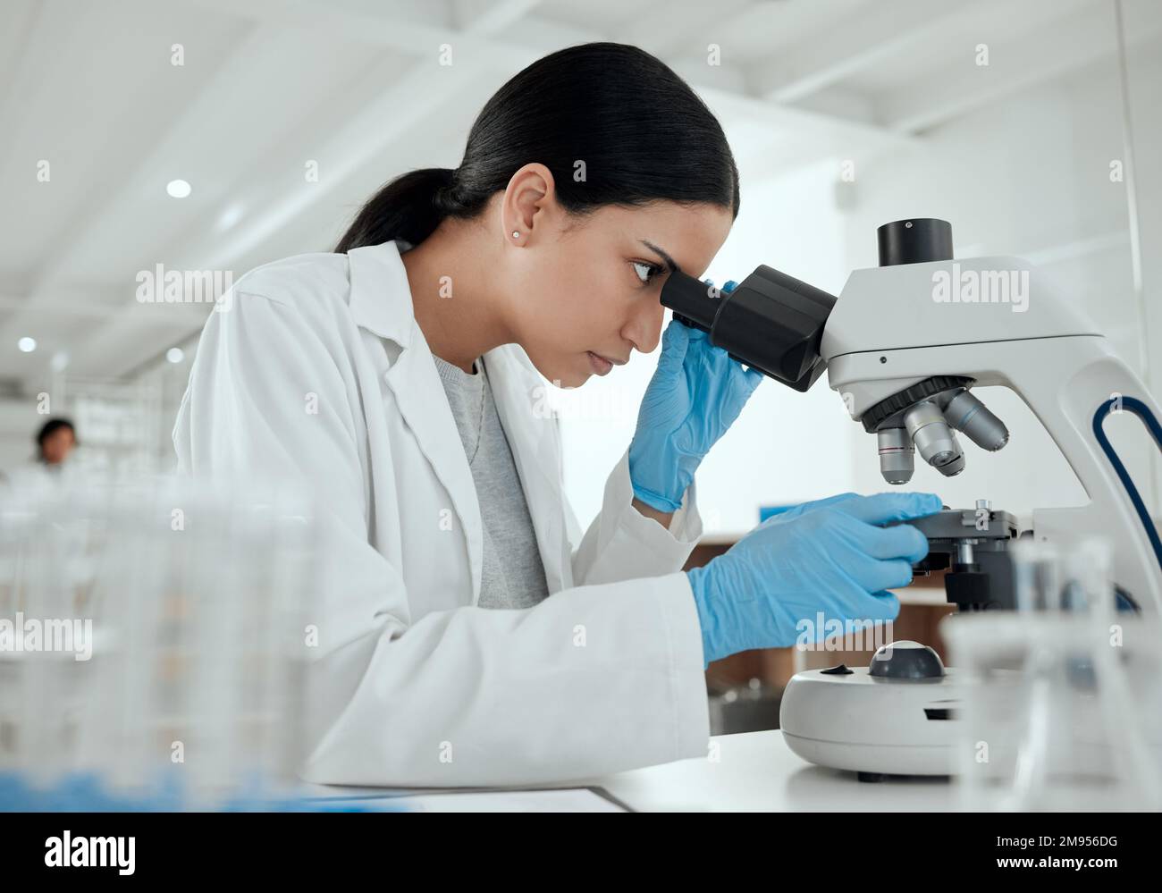 Dedication is the only way to get this done. a young woman using a ...