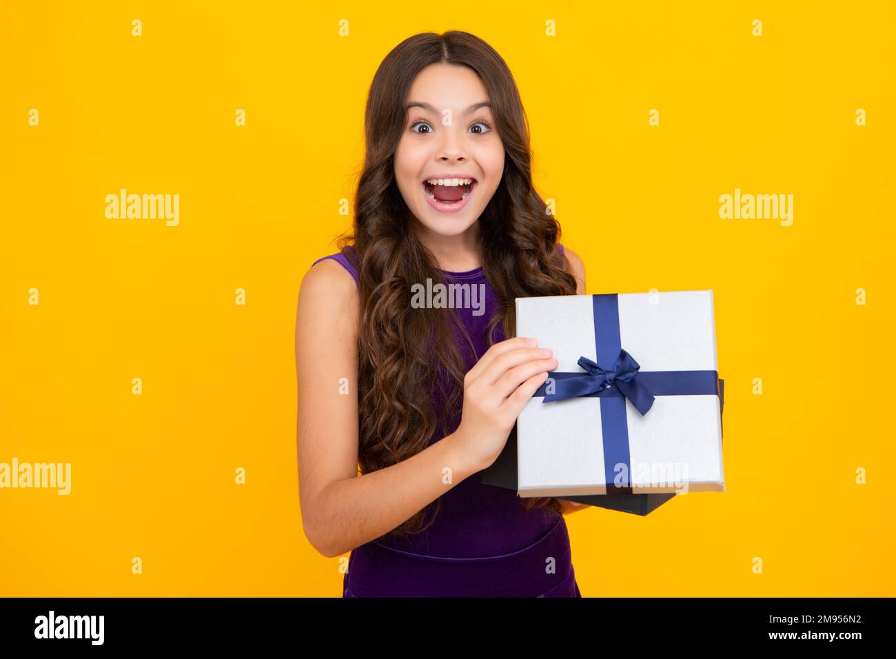 Teenage kid with present box. Teen girl giving birthday gift. Present ...